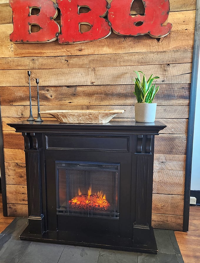 Even the fireplace knows its role in this temple of smoke—creating that warm, inviting atmosphere that makes you want to linger just a little longer. 