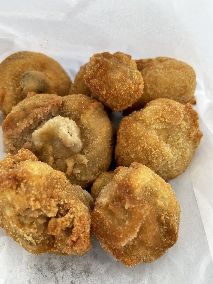 These aren't just fried mushrooms; they're little umami bombs waiting to explode with earthy goodness in your unsuspecting mouth.