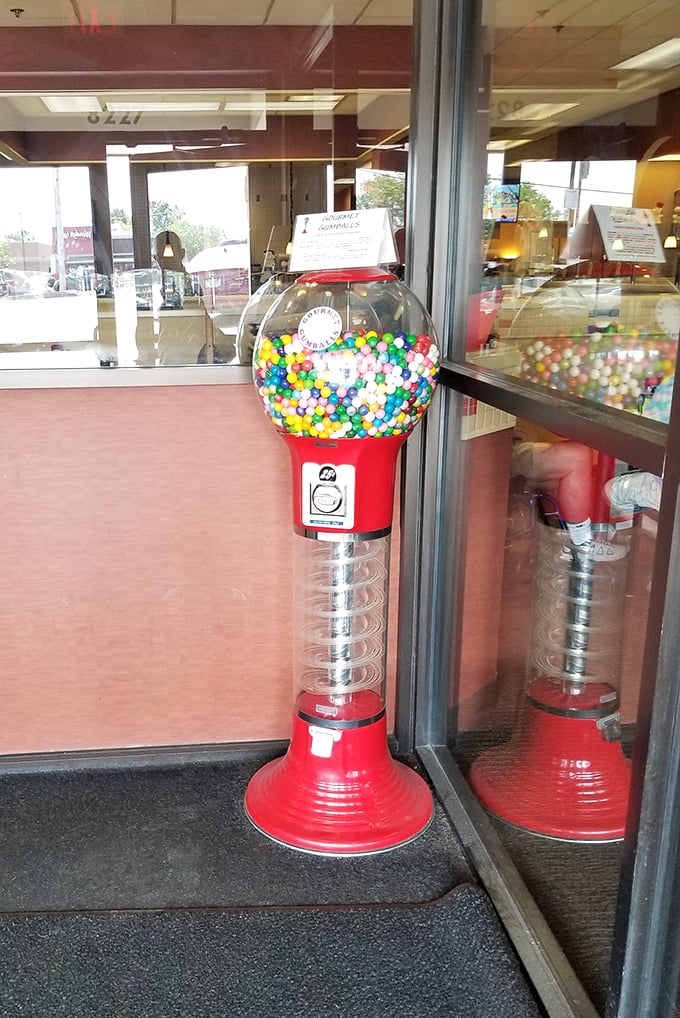 A gumball machine stands sentinel by the door—a sweet farewell or welcome, depending on which direction you're heading.
