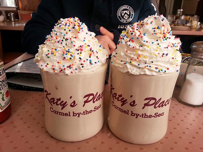These festive hot chocolate mountains topped with whipped cream and sprinkles aren't just drinks—they're childhood nostalgia in ceramic form.