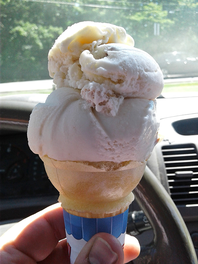 Ice cream stacked so high it defies both gravity and restraint—the perfect mobile dessert for cruising down Mentor Avenue on a summer day.