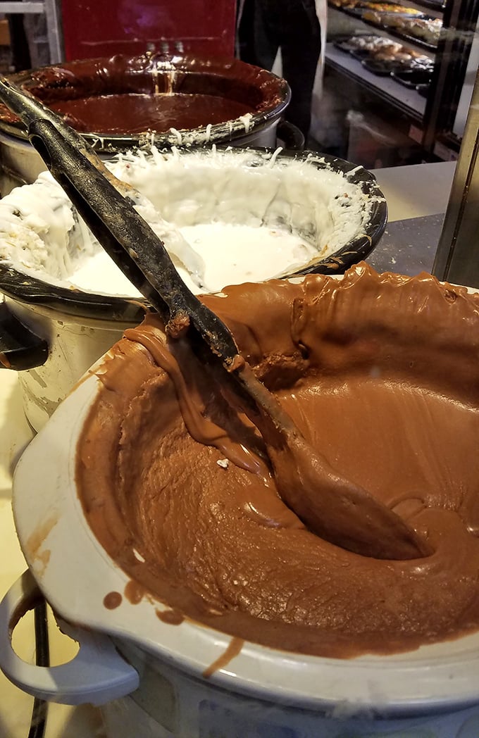 The secret behind the magic: vats of chocolate and vanilla cream waiting to become the heart and soul of your favorite donut.