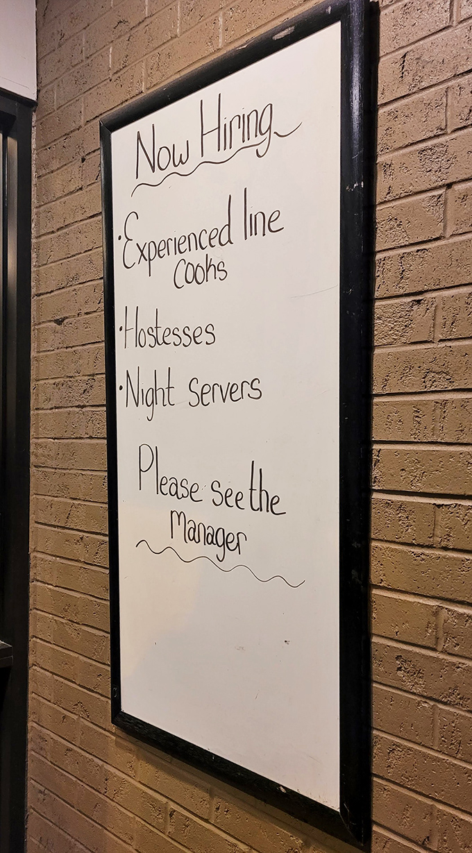 The "Now Hiring" sign—a humble reminder that behind every great meal is a team of dedicated people making the magic happen in real time.
