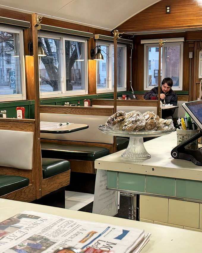 The booth section—where family memories are made between coffee refills and the dessert display tempts you before you've even ordered your main course.
