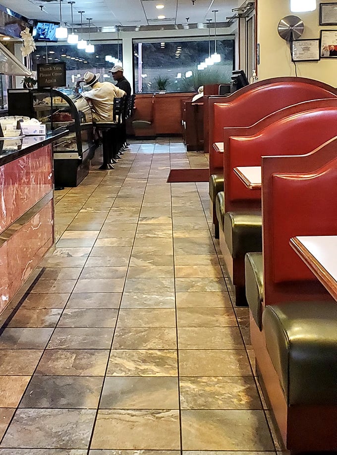Red booths line the walkway like loyal sentinels guarding the temple of comfort food. In this sanctuary of sustenance, calories don't count and diet talk is gently discouraged.