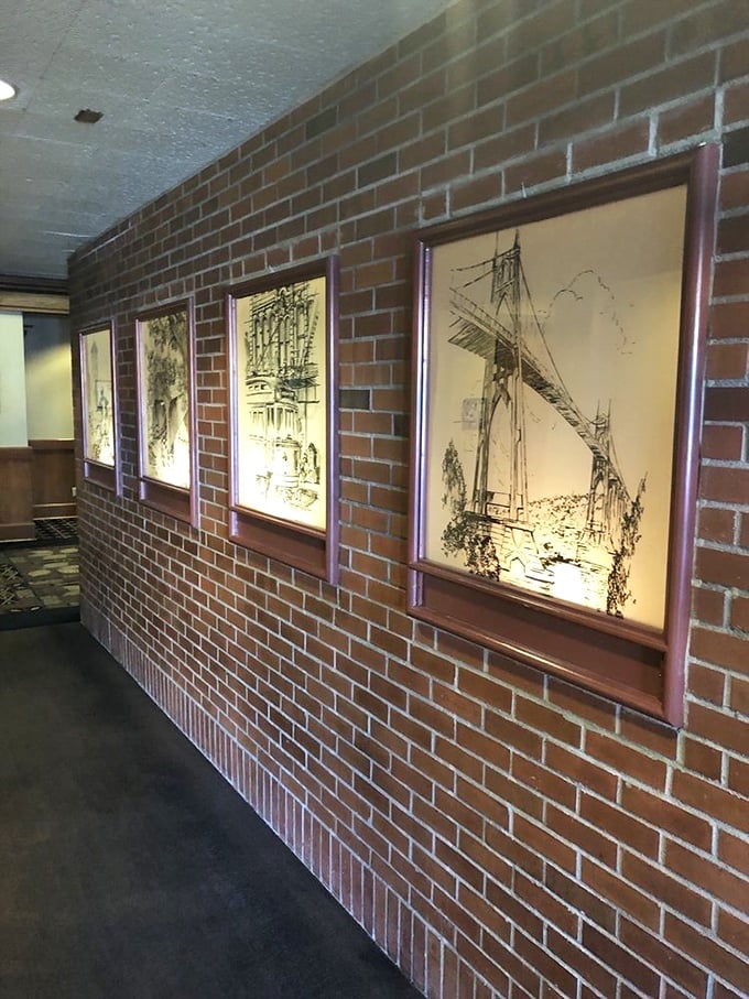 Portland landmarks illustrated on brick—a gallery where art meets appetite. These walls could tell stories if they weren't busy absorbing steak aromas.