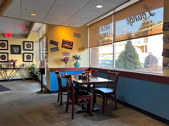 Corner booths: the real estate everyone secretly covets. Blue wainscoting and warm lighting create that "stay awhile" vibe that turns meals into memories.