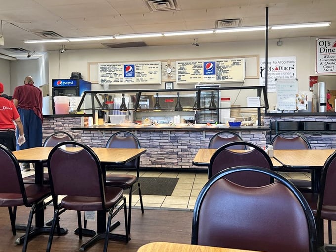 The cafeteria line at OJ's – where the hardest life decision you'll make today is choosing which homemade sides deserve precious real estate on your plate.