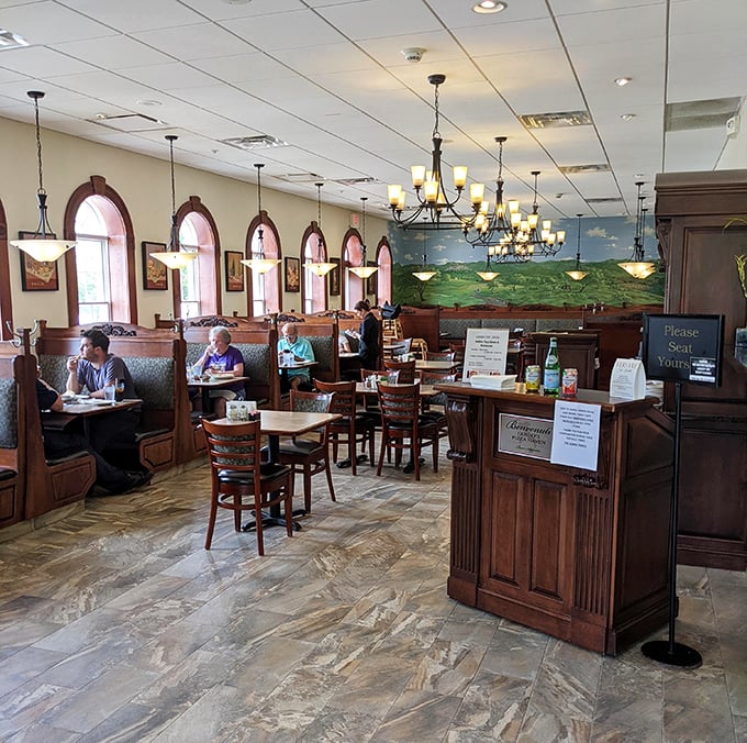 The main dining room balances casual comfort with touches of elegance—those arched windows letting in light that makes everyone look their best.