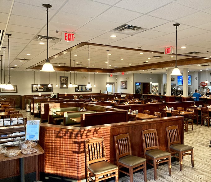 The dining room stretches invitingly with booths and tables arranged for both privacy and community – a masterclass in diner architecture.