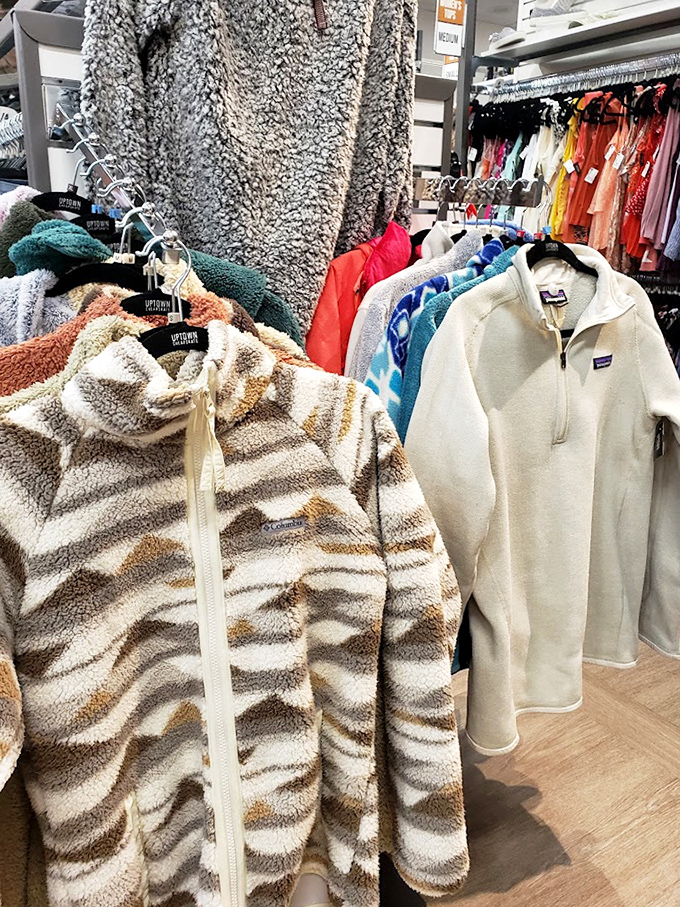 Fuzzy treasures and Patagonia finds hanging side by side—proof that comfort and style aren't mutually exclusive concepts.