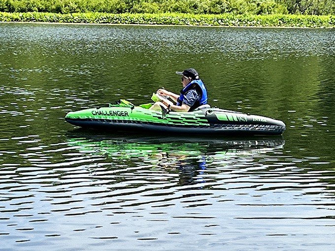 Solo kayaking on glass-like waters – sometimes the best company is the gentle splash of your paddle and your own thoughts.