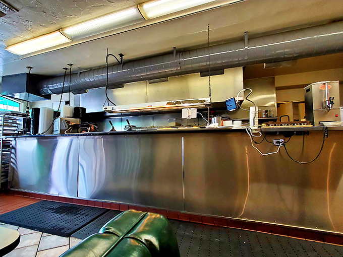 The kitchen pass – that magical portal where orders go in and comfort comes out, stainless steel gleaming with promise.