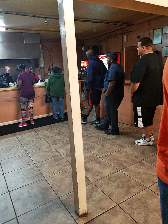 The anticipation in this line is palpable. These customers know they're moments away from the kind of meal that makes Monday meetings bearable.