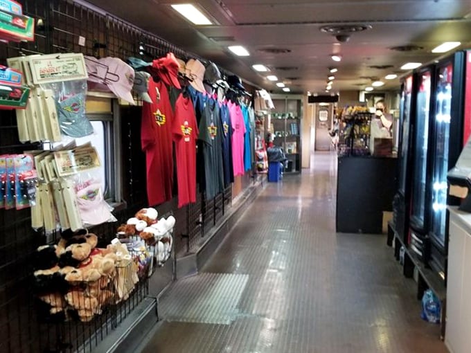 The gift shop car ensures nobody leaves without a souvenir—because what's a memorable journey without a t-shirt to prove you were there?