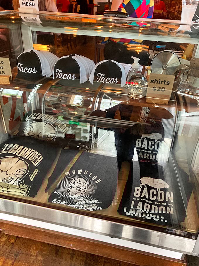 Even the merch display shows personality—because nothing says "I had an amazing meal" like a taco hat souvenir.
