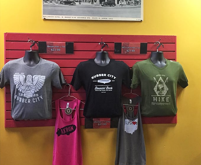 Akron pride on display with "Rubber City" merchandise—because nothing says "I love this town" like wearing your breakfast spot's t-shirt.