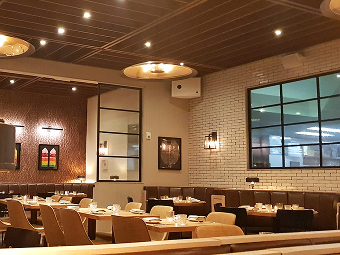 The restaurant's thoughtful design creates distinct dining zones that somehow feel both intimate and part of a larger, joyful experience.