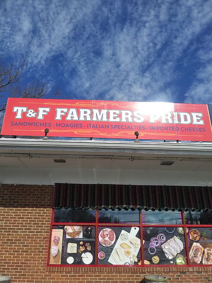 Under brilliant blue skies, the T&F sign stands as a beacon to the sandwich-seeking pilgrims who know that greatness often hides in humble places.