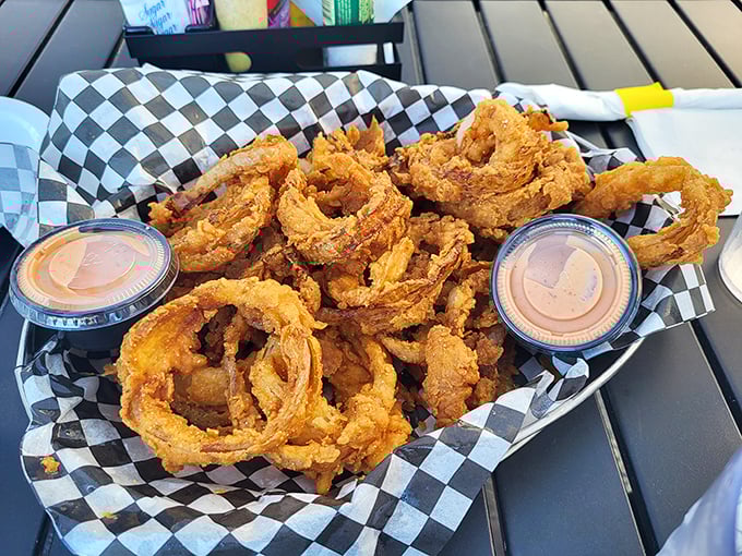 Onion rings that shatter with satisfying crispness – these golden halos are what fast food chains wish their rings could grow up to be.