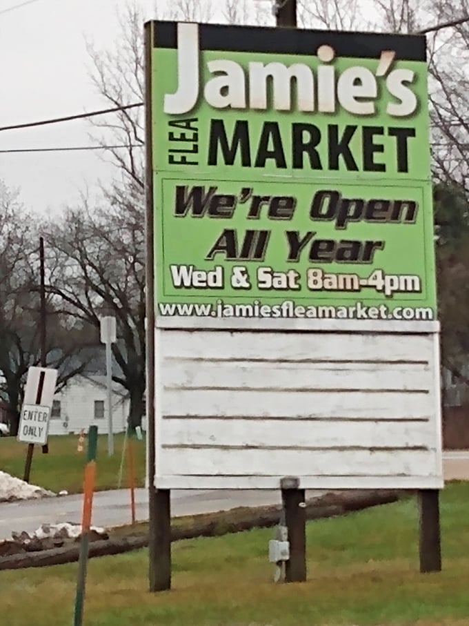 The market's roadside beacon announces year-round Wednesday and Saturday treasure hunting—like a lighthouse for bargain seekers lost at sea.