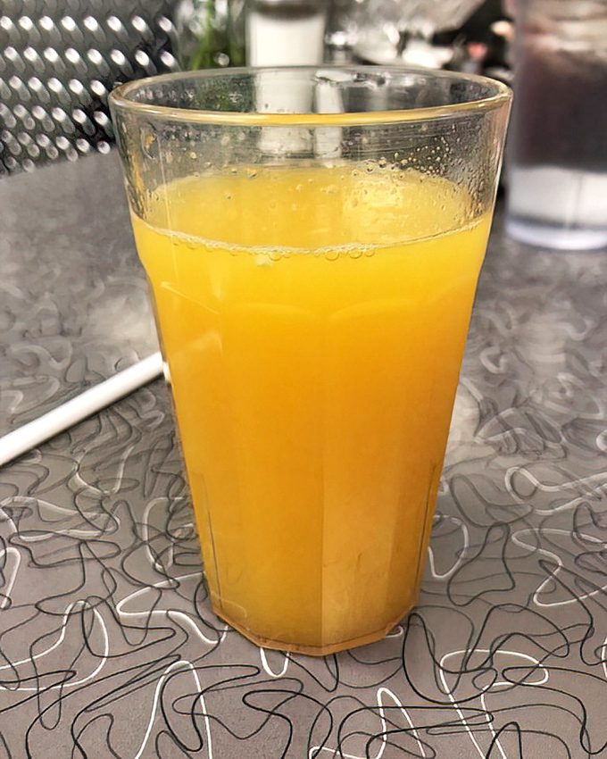 Fresh-squeezed sunshine in a glass—the kind of orange juice that makes you question why you ever settled for the stuff from a carton.