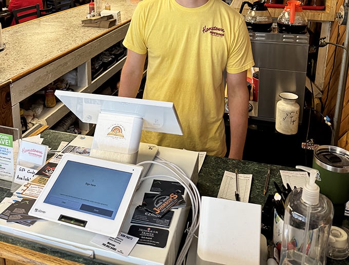 The heart of operations – where orders are taken, jokes are exchanged, and the magic of Hometown Hot Dogs begins its journey to your plate.