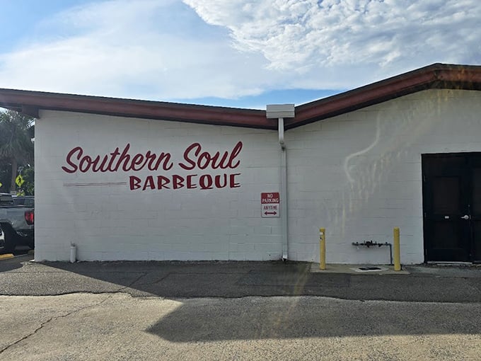 Simple white walls with that bold red logo—like a barbecue haiku that says everything it needs to with minimal fuss and maximum impact.