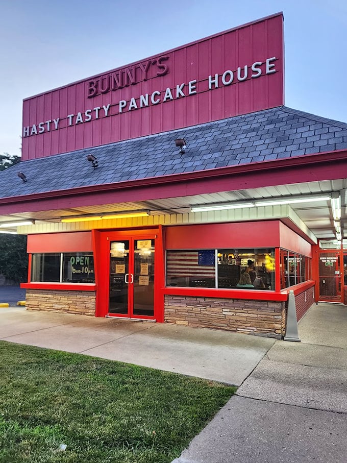 Evening light bathes the red exterior in a warm glow, promising tomorrow's breakfast will be worth getting out of bed for.