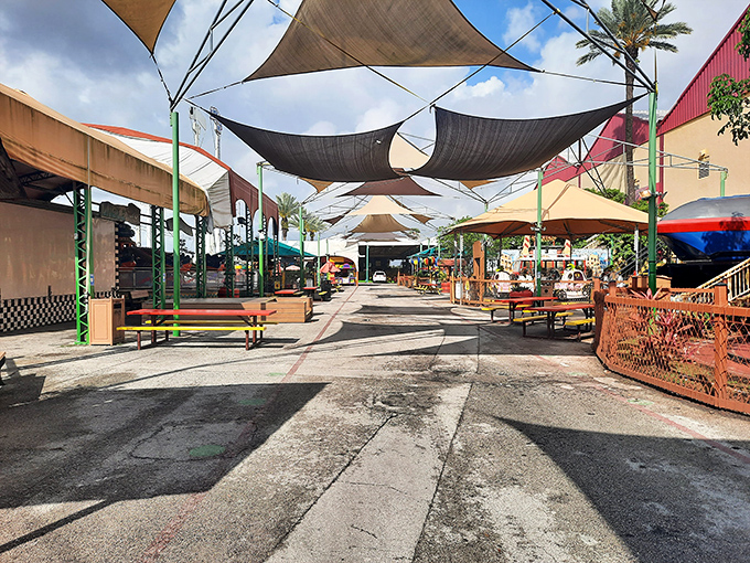 Canvas shade sails create a desert bazaar atmosphere in this outdoor section, where the Florida sun is kept at bay while the shopping heats up.