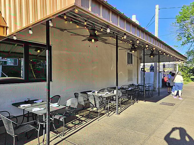 Al fresco dining with string lights overhead—because pasta tastes even better with a side of fresh air and people-watching.
