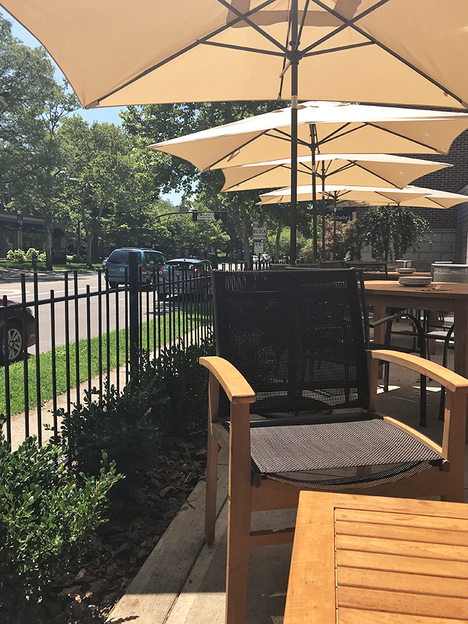 Outdoor seating that captures Ohio's fleeting summer days perfectly. Those umbrellas aren't just for shade—they're for extending precious patio season.