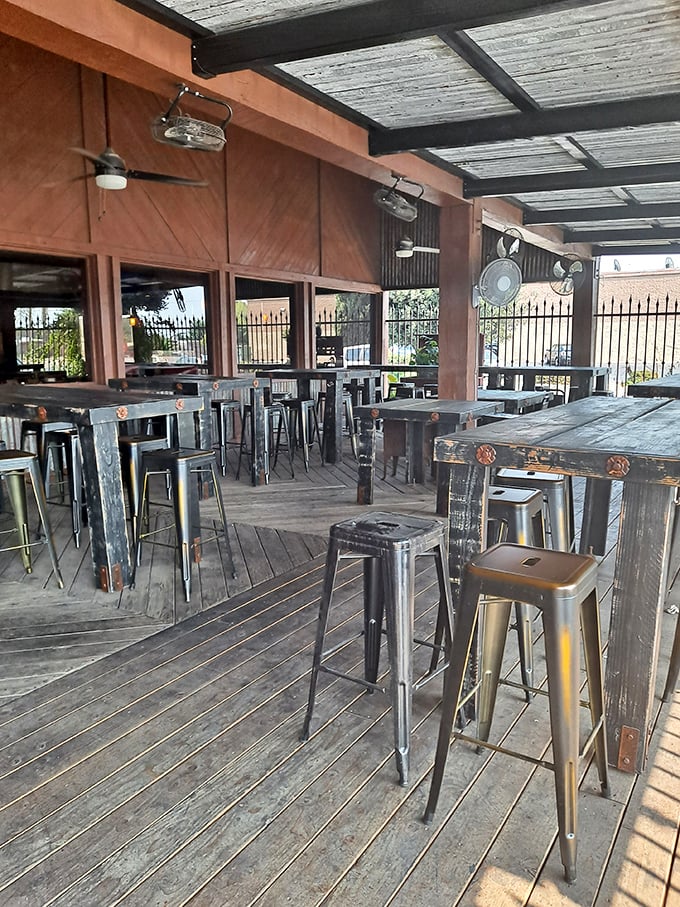 The outdoor seating area – where fresh air meets fresh food, and industrial-chic design creates the perfect backdrop for casual dining.
