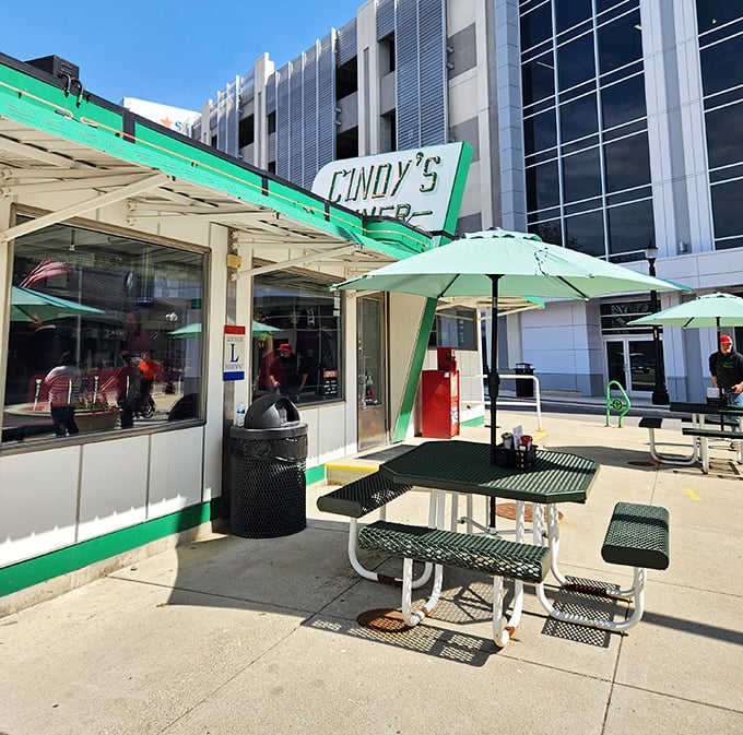 Al fresco dining, diner-style. Those green umbrellas aren't just for shade—they're beacons signaling "Good food happens here!"