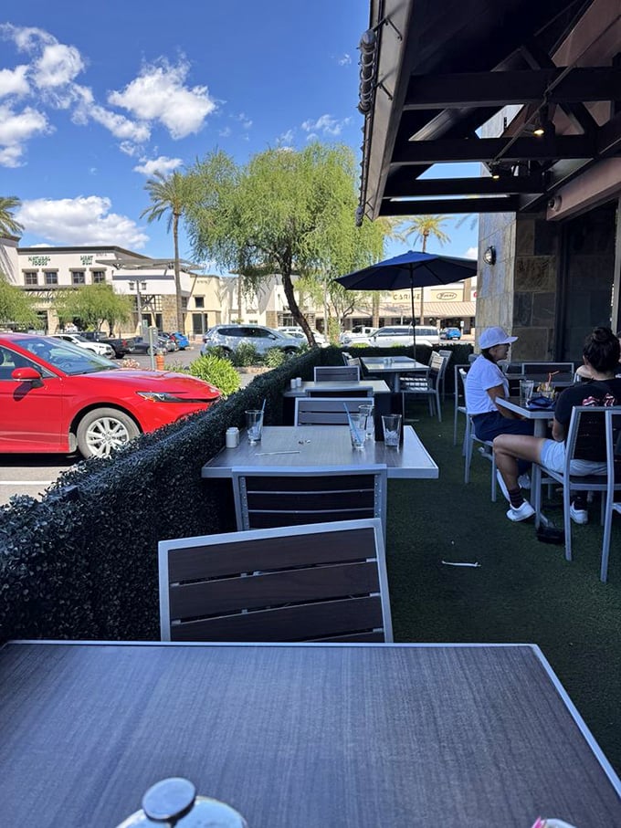 Outdoor seating that captures Arizona's perfect weather, proving that vitamin D and breakfast are the power couple we all need.