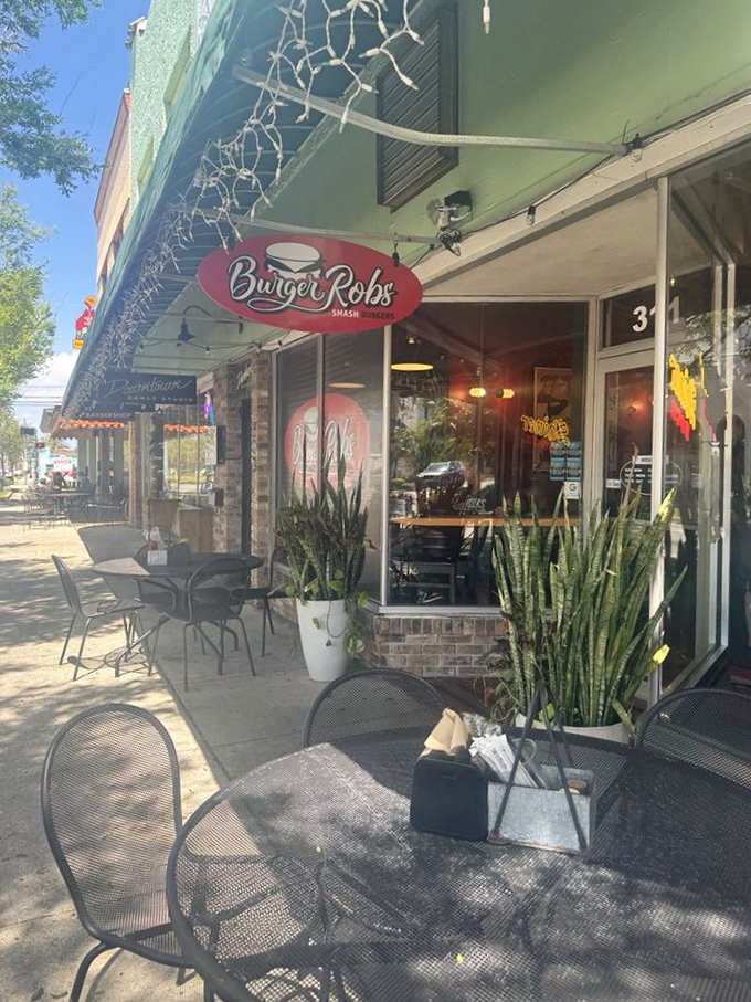Outdoor seating dappled in Florida sunshine offers the perfect spot to contemplate the meaning of life—or just how they make those burgers so darn good.
