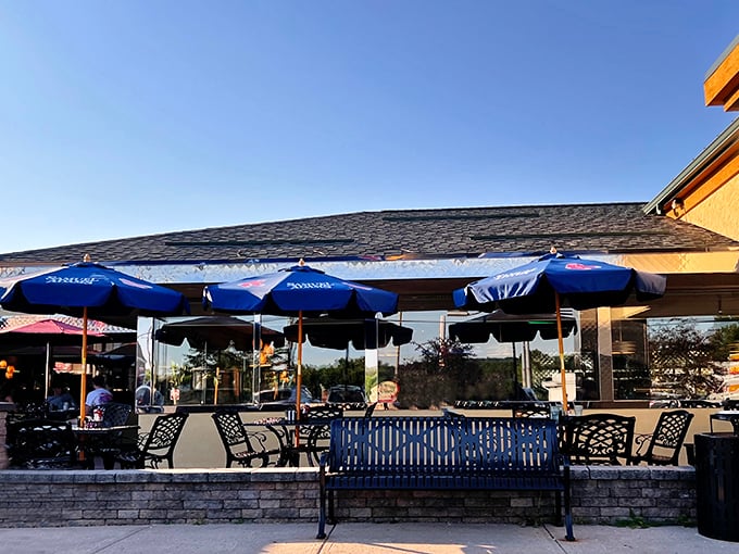 Summer dining perfection—umbrella-shaded outdoor tables where pancakes taste even better with a side of fresh air.