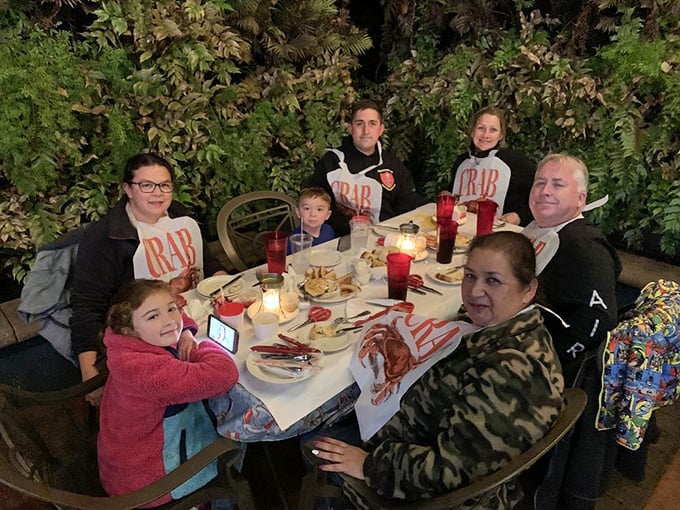 Family-style dining with those signature bibs – because the best seafood experiences are measured in napkins used and memories made.