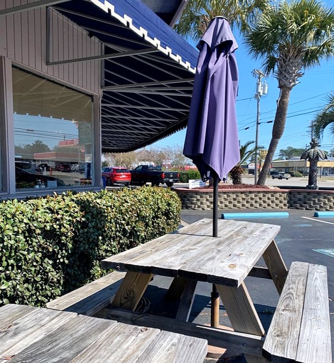 Al fresco dining with a side of people-watching—these picnic tables have witnessed countless vacation plans being hatched.