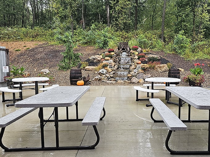 The outdoor seating area offers a tranquil backdrop of nature's best work—complete with a gentle waterfall that provides dinner and a show.