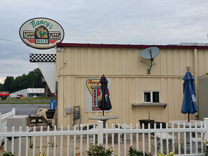 The unassuming exterior of Nancy's Main Street Diner, complete with white picket fence, belies the extraordinary comfort food waiting inside.