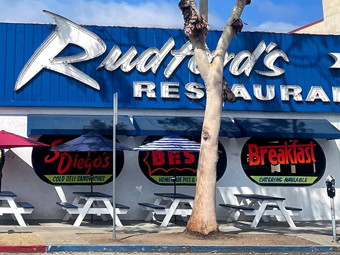 Those outdoor tables under umbrellas – because sometimes your food coma needs fresh air and California sunshine.