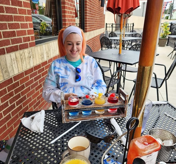 Outdoor dining with colorful drink samplers—summer in Ohio distilled into one perfect moment. Sunshine and sips make everything better.