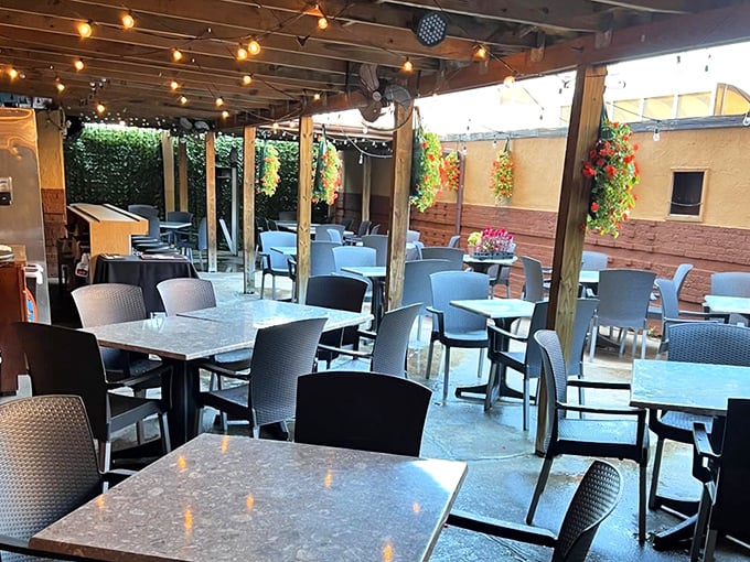 The patio beckons with the promise of al fresco dining—where summer breezes complement melted cheese and cold beer in perfect harmony.