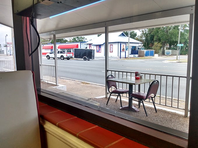 The view from inside – where you can watch Pensacola wake up while you contemplate a second cup of coffee and maybe, just maybe, one more biscuit.