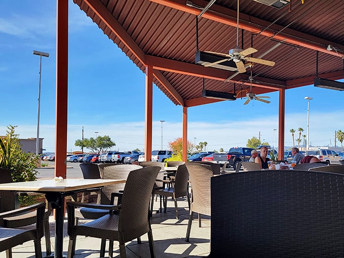 The outdoor seating area offers Tucson's famous blue skies as a side dish. Desert dining with ceiling fans—Arizona's version of climate control.