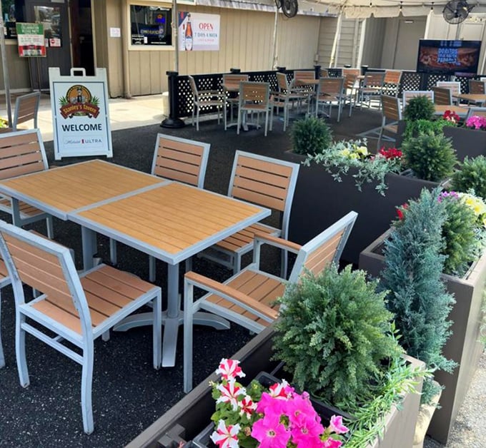 Outdoor seating surrounded by greenery creates an urban oasis. Delaware summers were made for evenings like this.