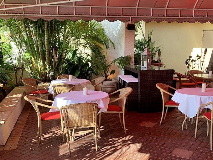 An outdoor patio offering al fresco dining under Florida's perpetual sunshine – because great steaks taste better outdoors.