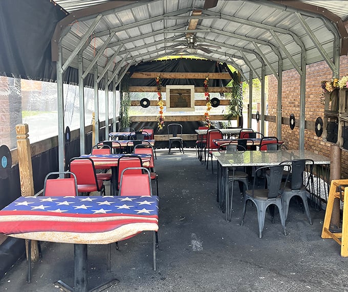 The outdoor seating area feels like America's front porch—complete with flag tablecloth and vinyl records keeping watch over your meal.