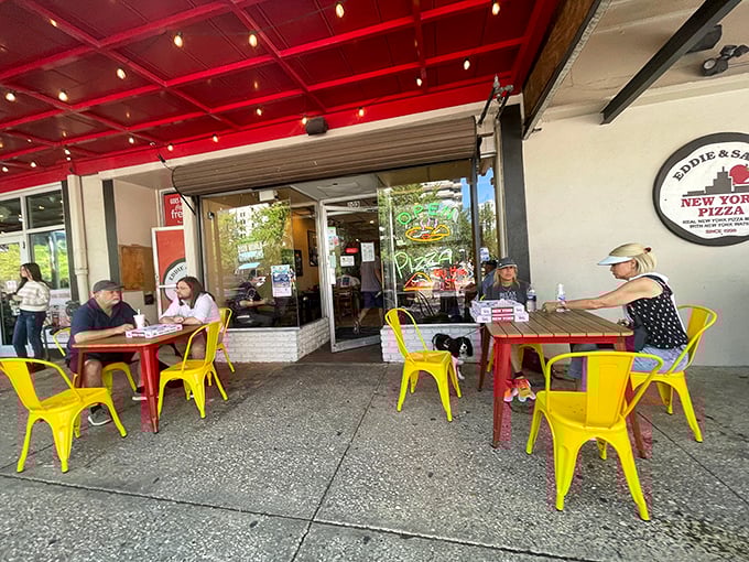 Cheerful yellow chairs outside invite you to enjoy your slice al fresco – pizza always tastes better with a side of people-watching.